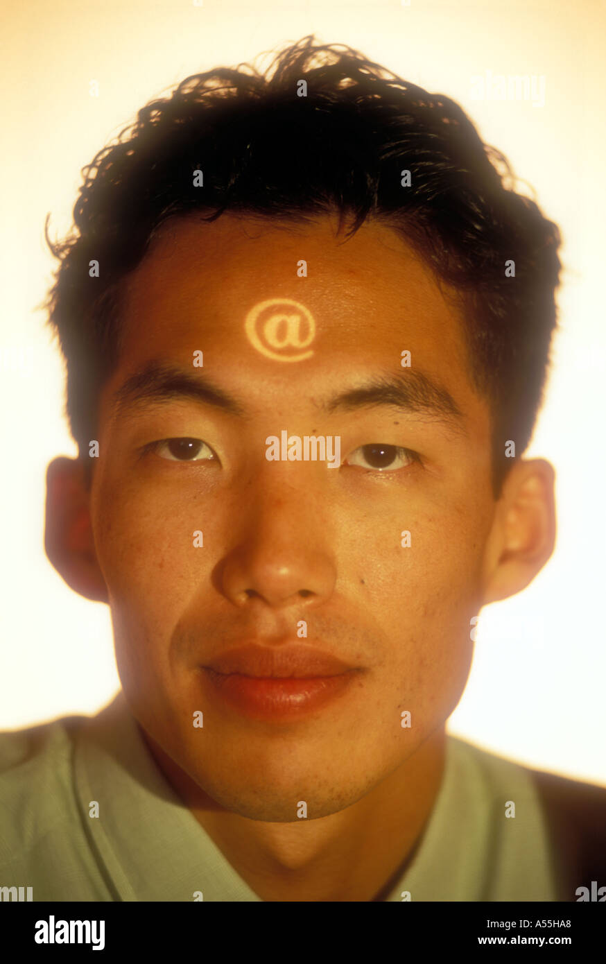 Asian man with symbol projected onto his forehead Model Released Photo ...