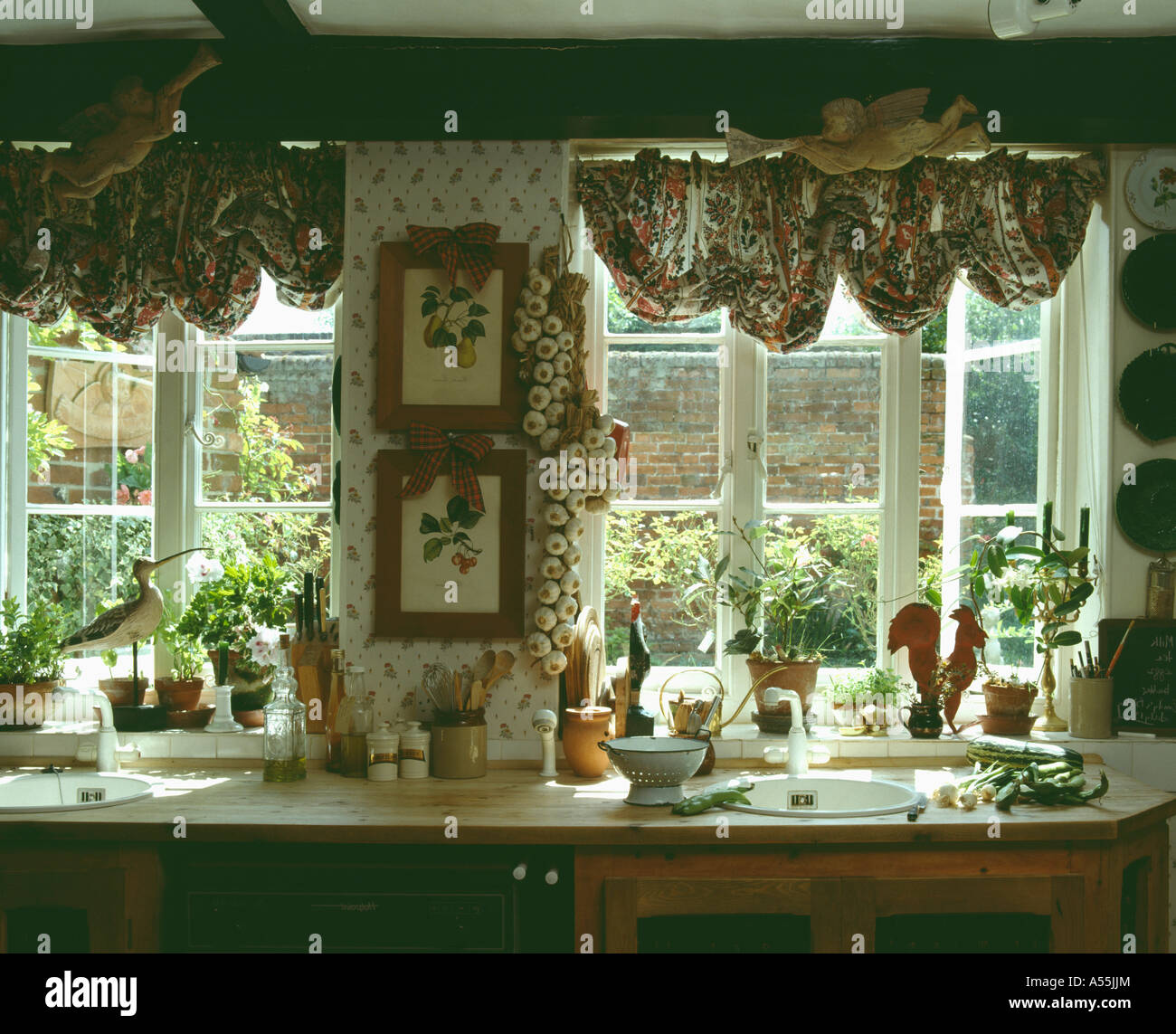 Close-up of cottage window with festoon blinds above sink Stock Photo ...