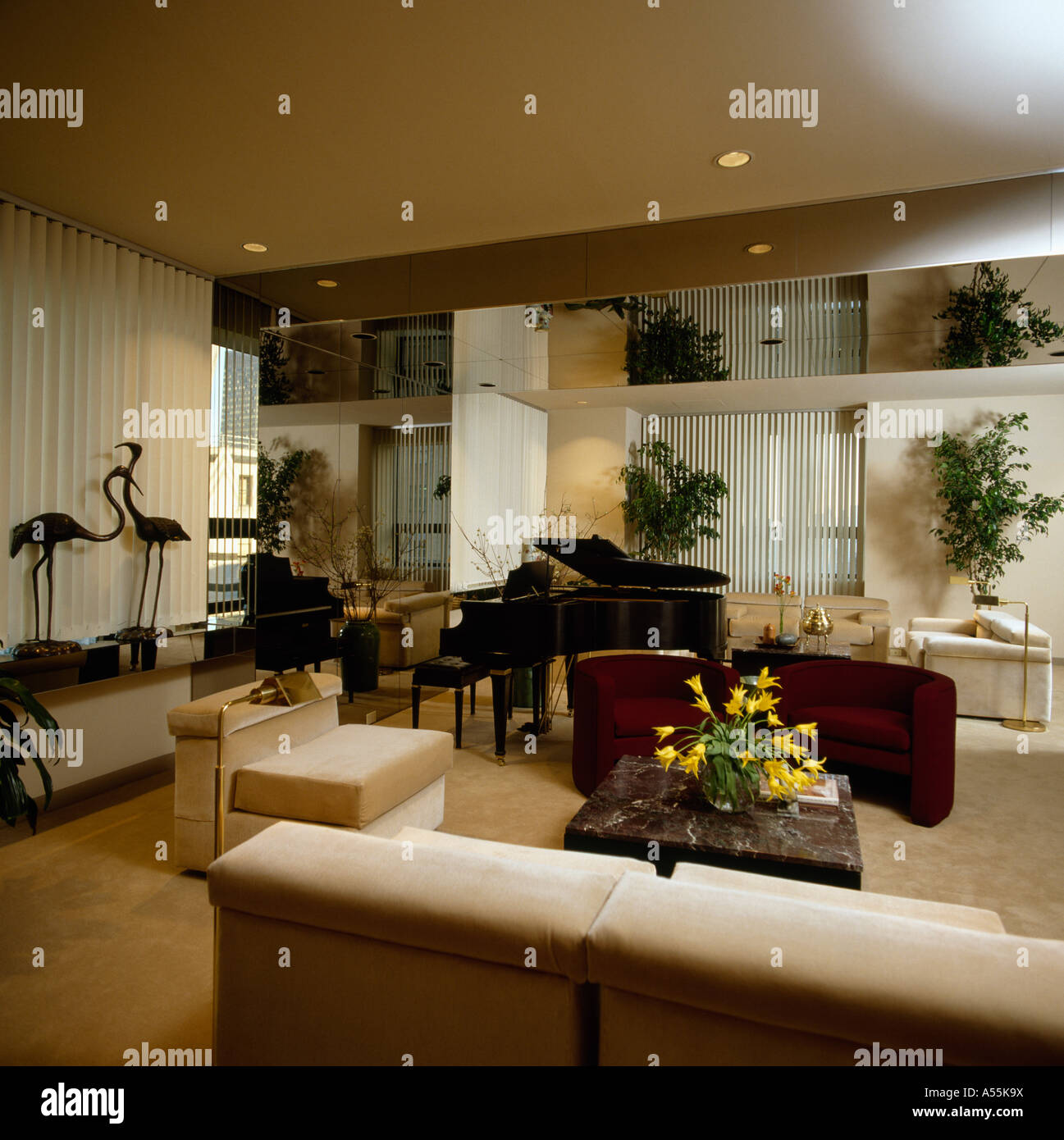 Neutral eighties sittingroom with mirrored wall and grand piano Stock ...