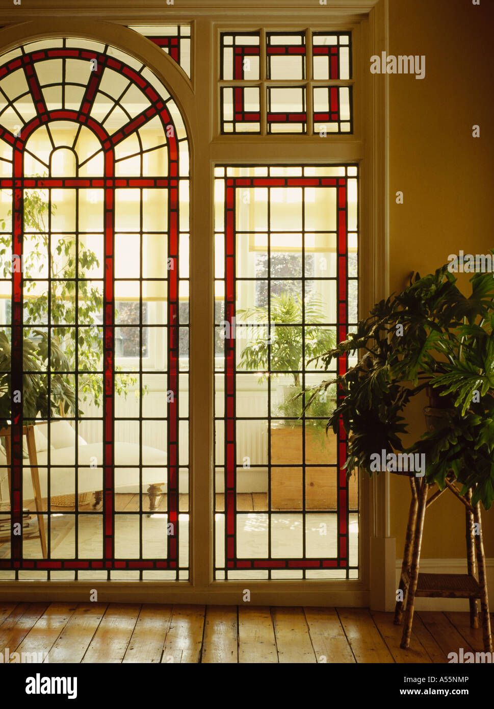 Large stained glass doors in traditional hall Stock Photo - Alamy