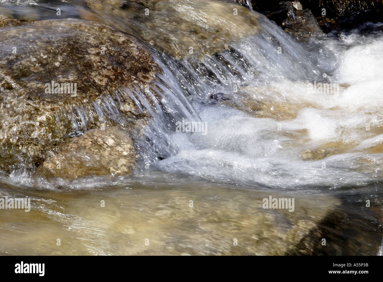 Water pouring over rocks in woods Stock Photo - Alamy