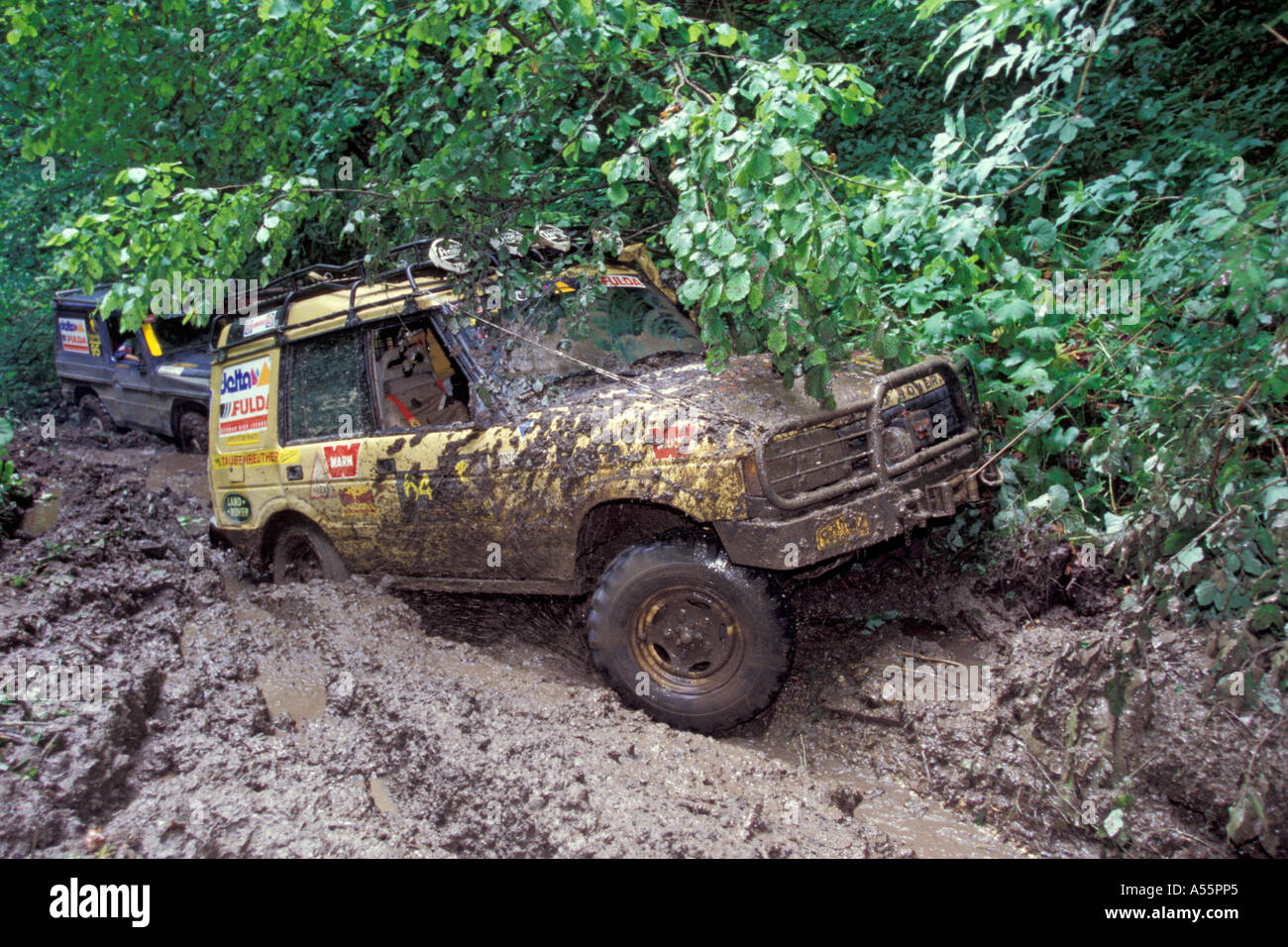 Offroad vehicle in mud Stock Photo - Alamy
