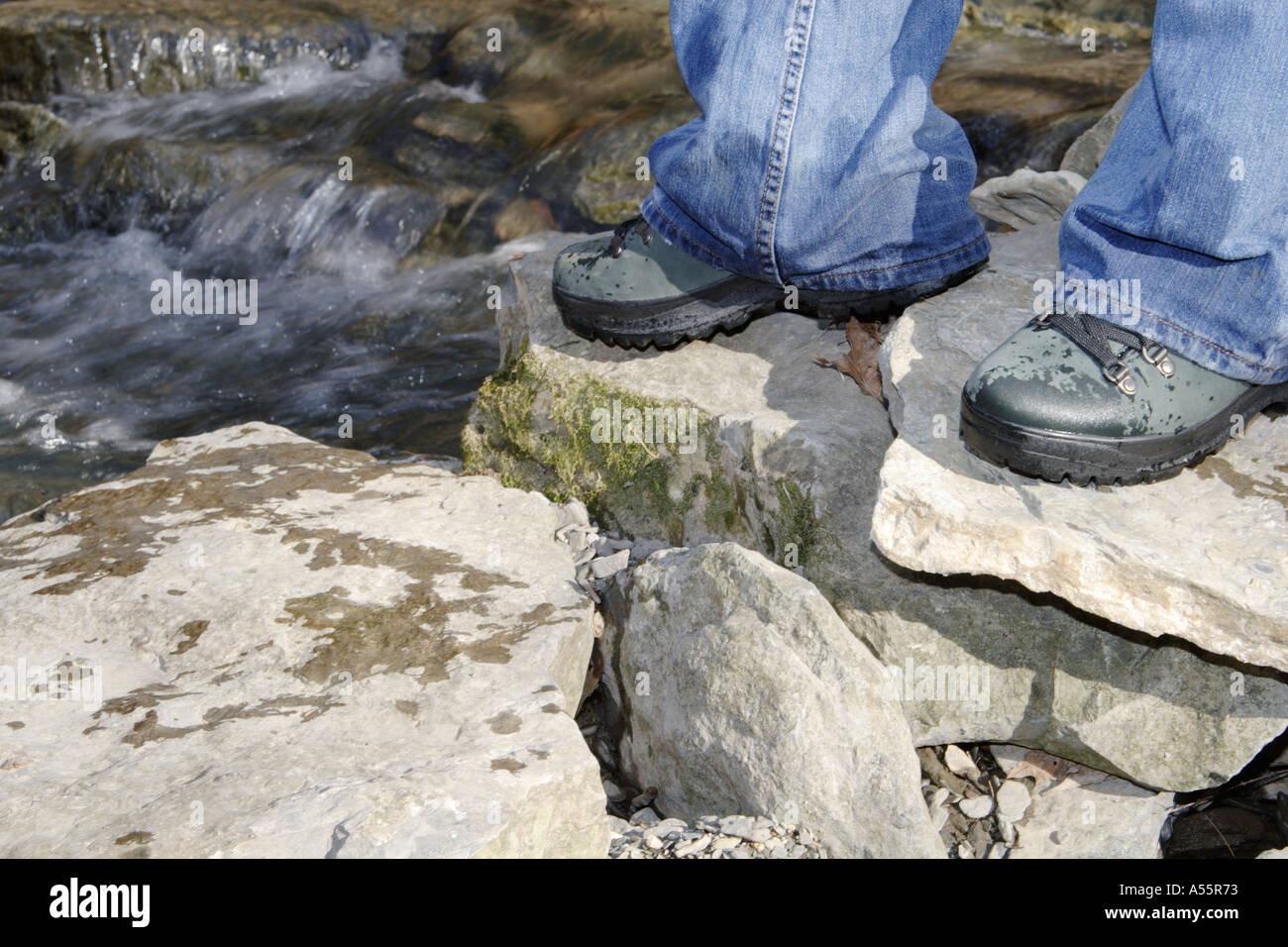 boots on top of rocks at stream edge Stock Photo - Alamy