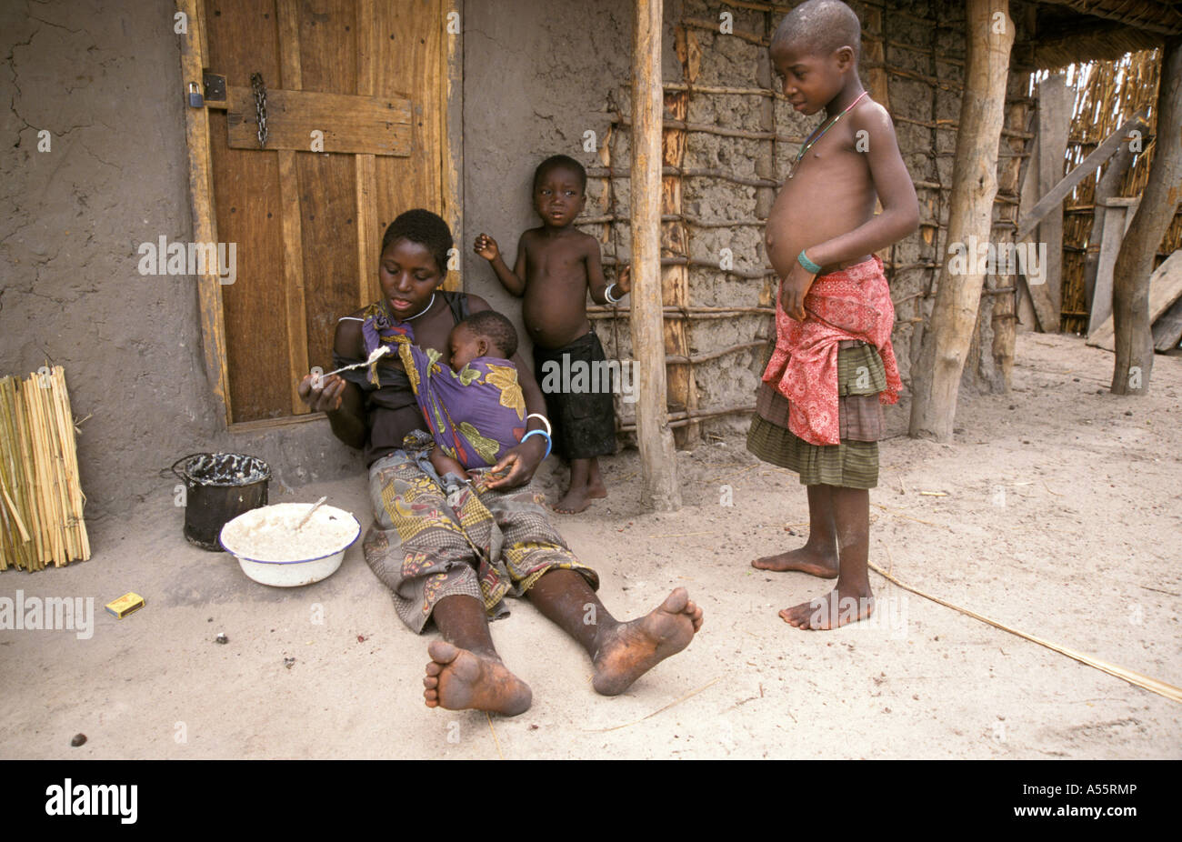 Painet is1700 zambia woman children eating nshima shamgombo country ...