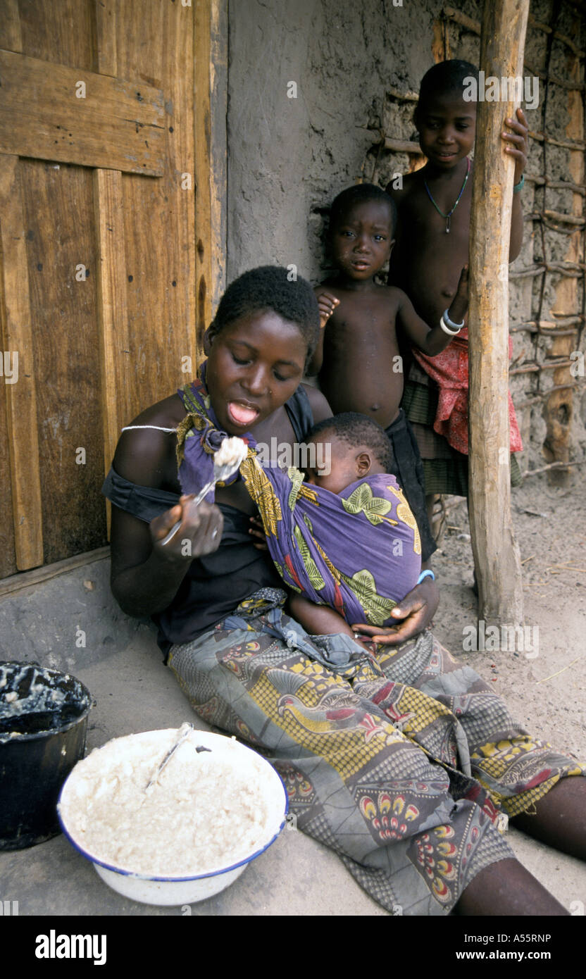 Painet is1701 zambia woman children eating nshima shangombo country ...