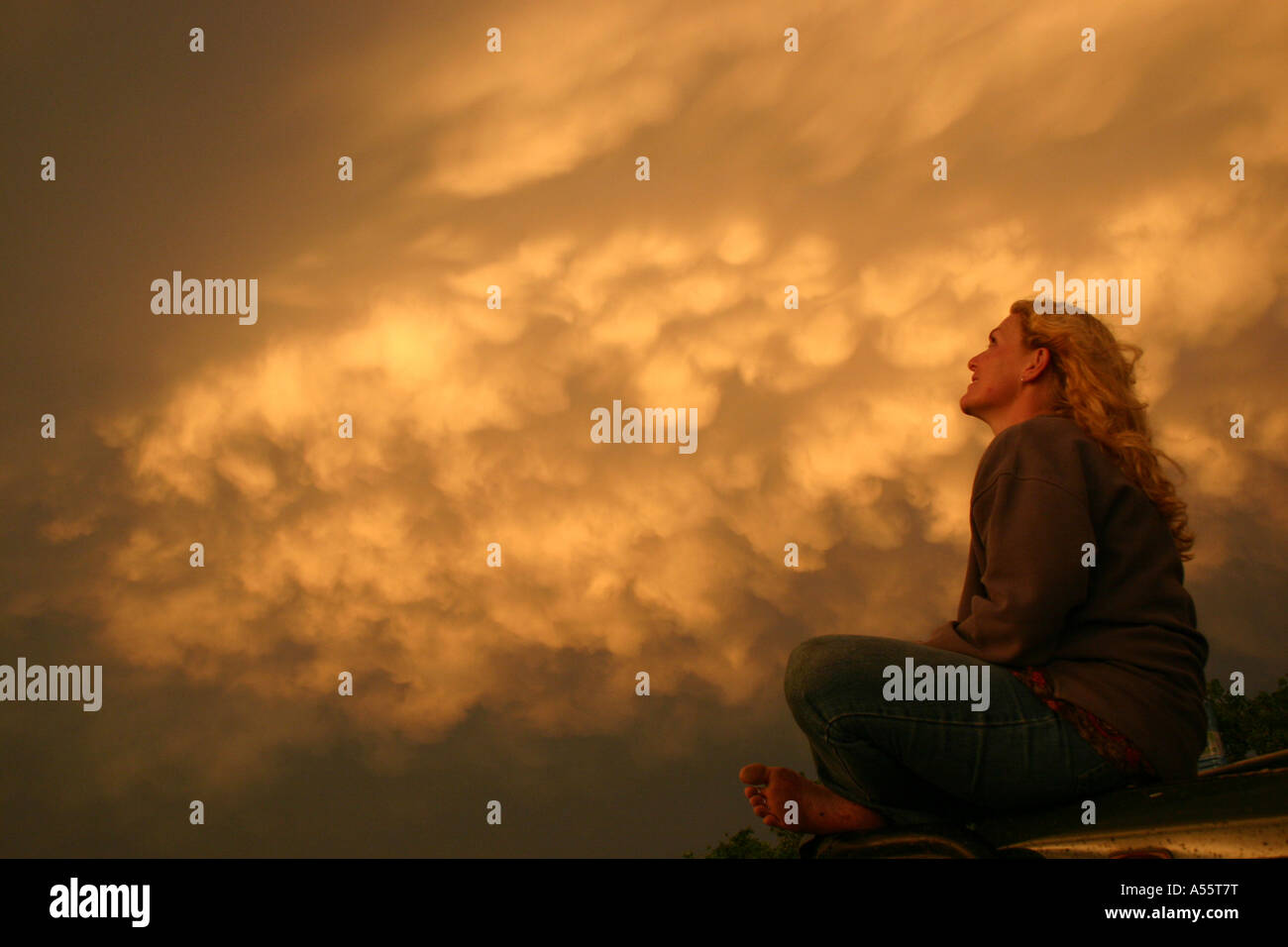 Girl sitting on car bonnet hi-res stock photography and images - Alamy