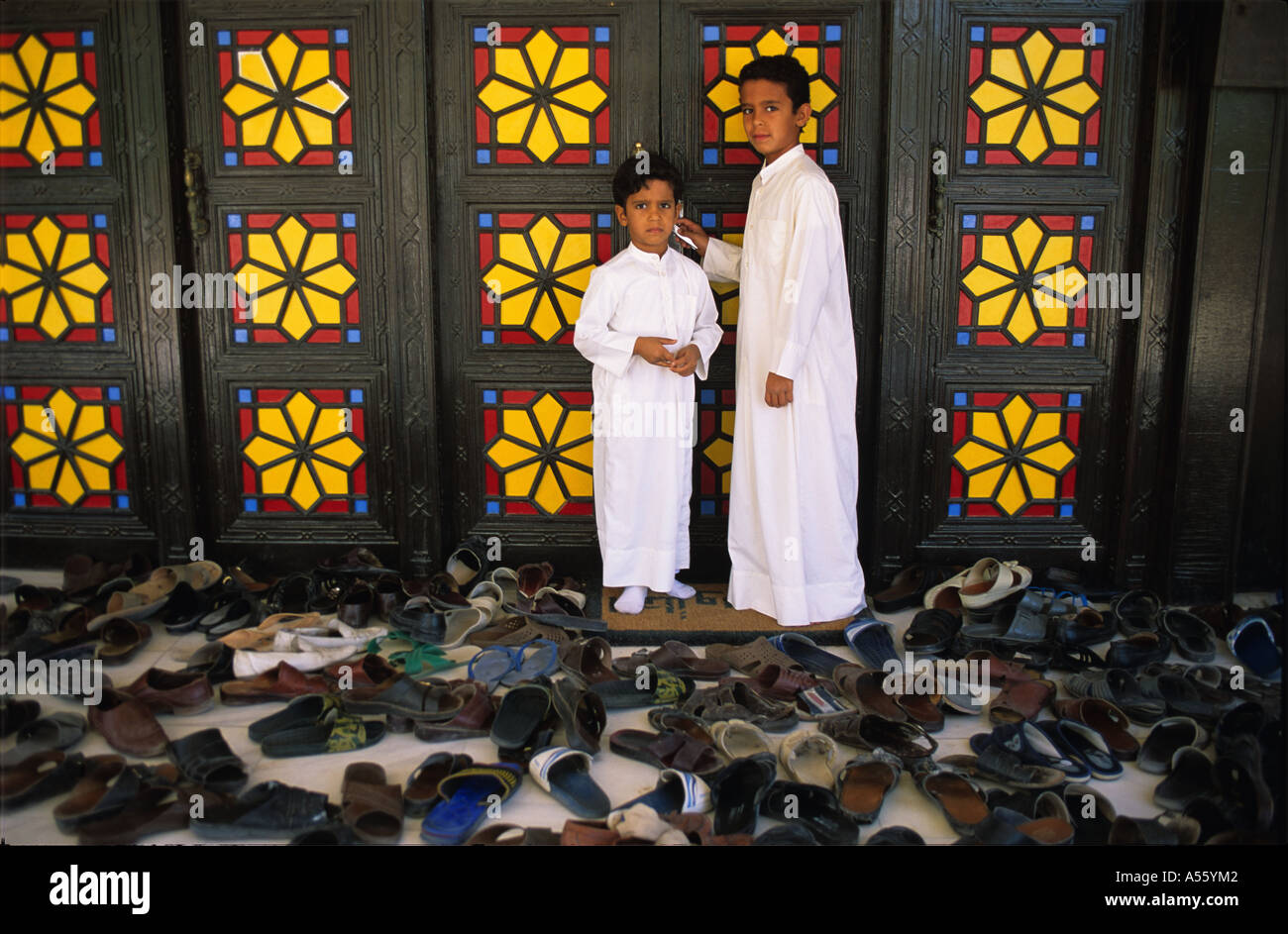 Muslim boys and shoes at a mosque entrance Kuwait Stock Photo - Alamy