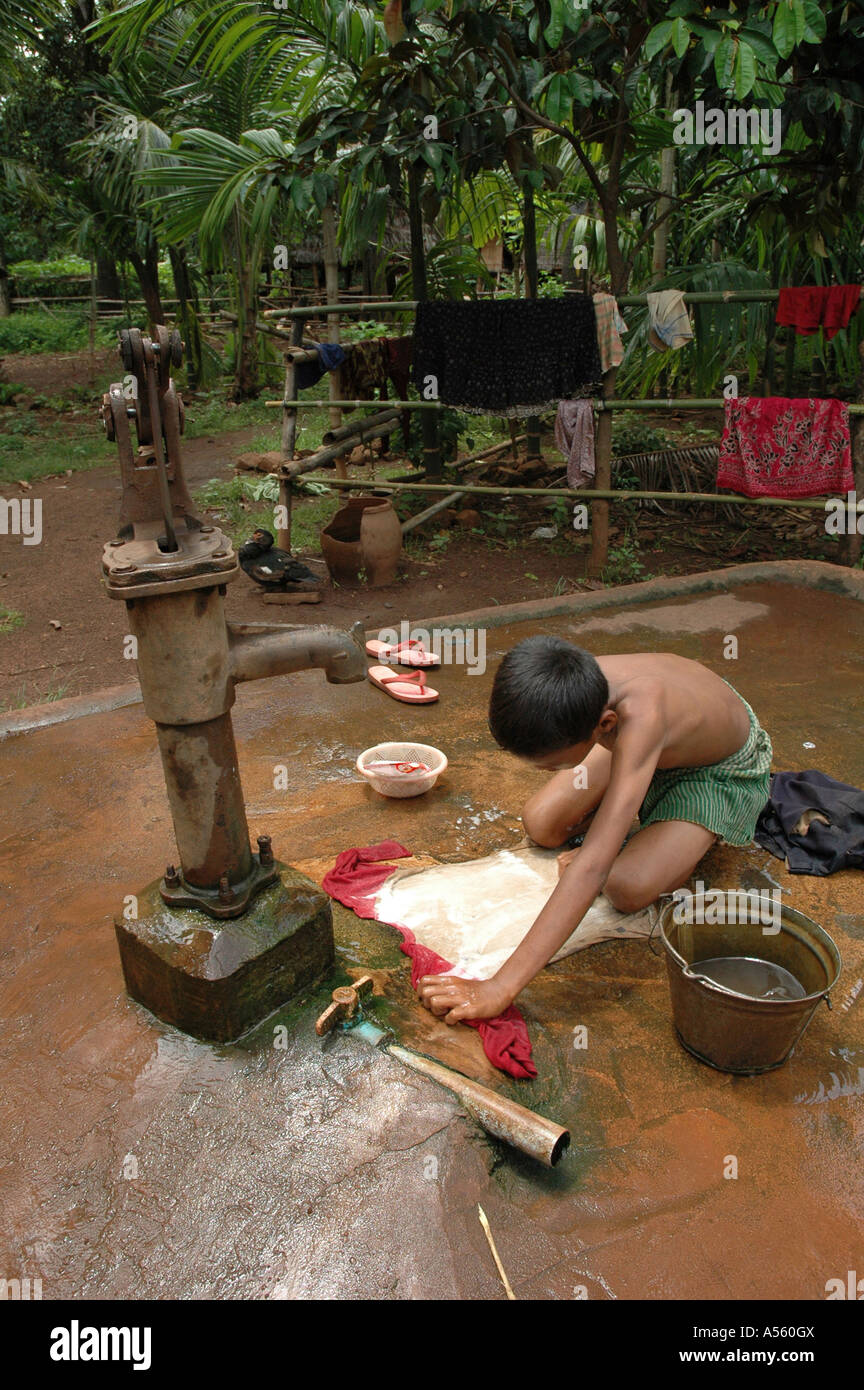Boy washing clothes hi-res stock photography and images - Alamy