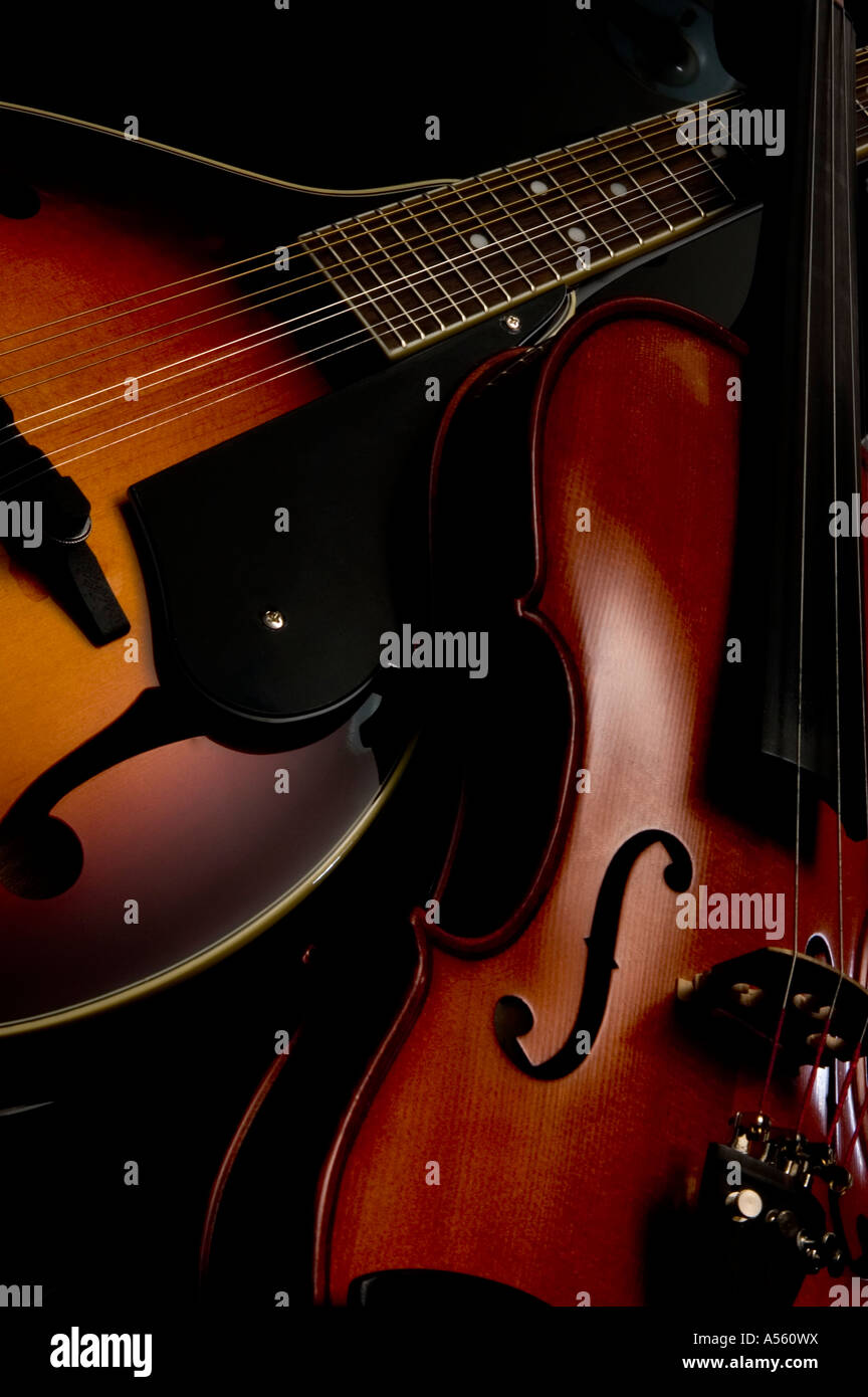 Mandolin and violin on black reflective background Stock Photo - Alamy