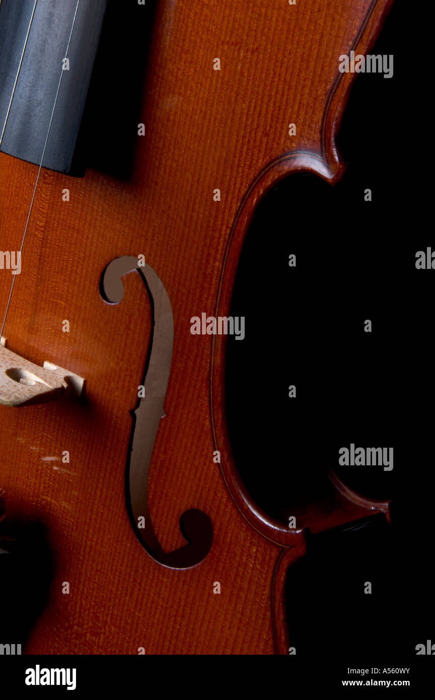 Close up of violin body on black background Stock Photo - Alamy