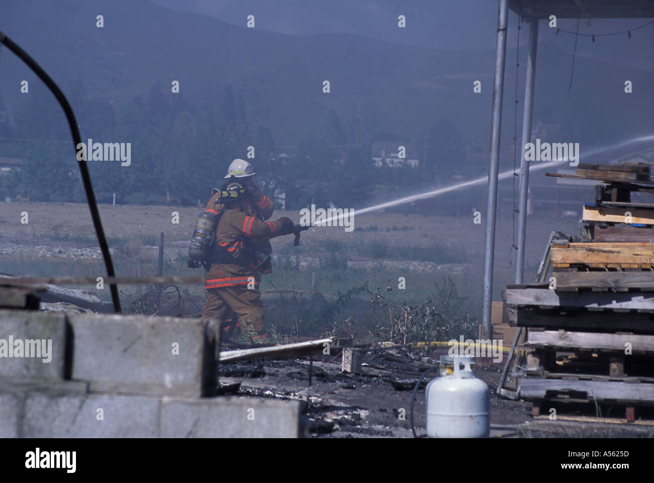 Firemen at fire training exercise Stock Photo - Alamy