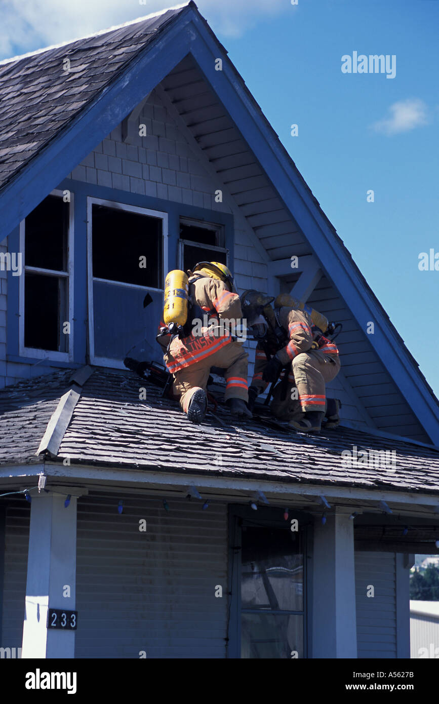 Firemen at fire training exercise for editorial Stock Photo - Alamy