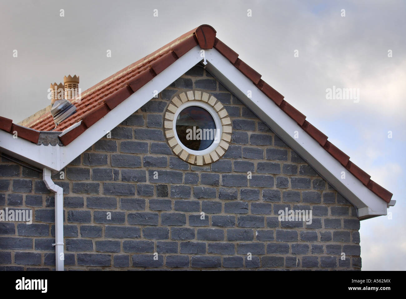 Gable of a house with a circular window hi-res stock photography and ...