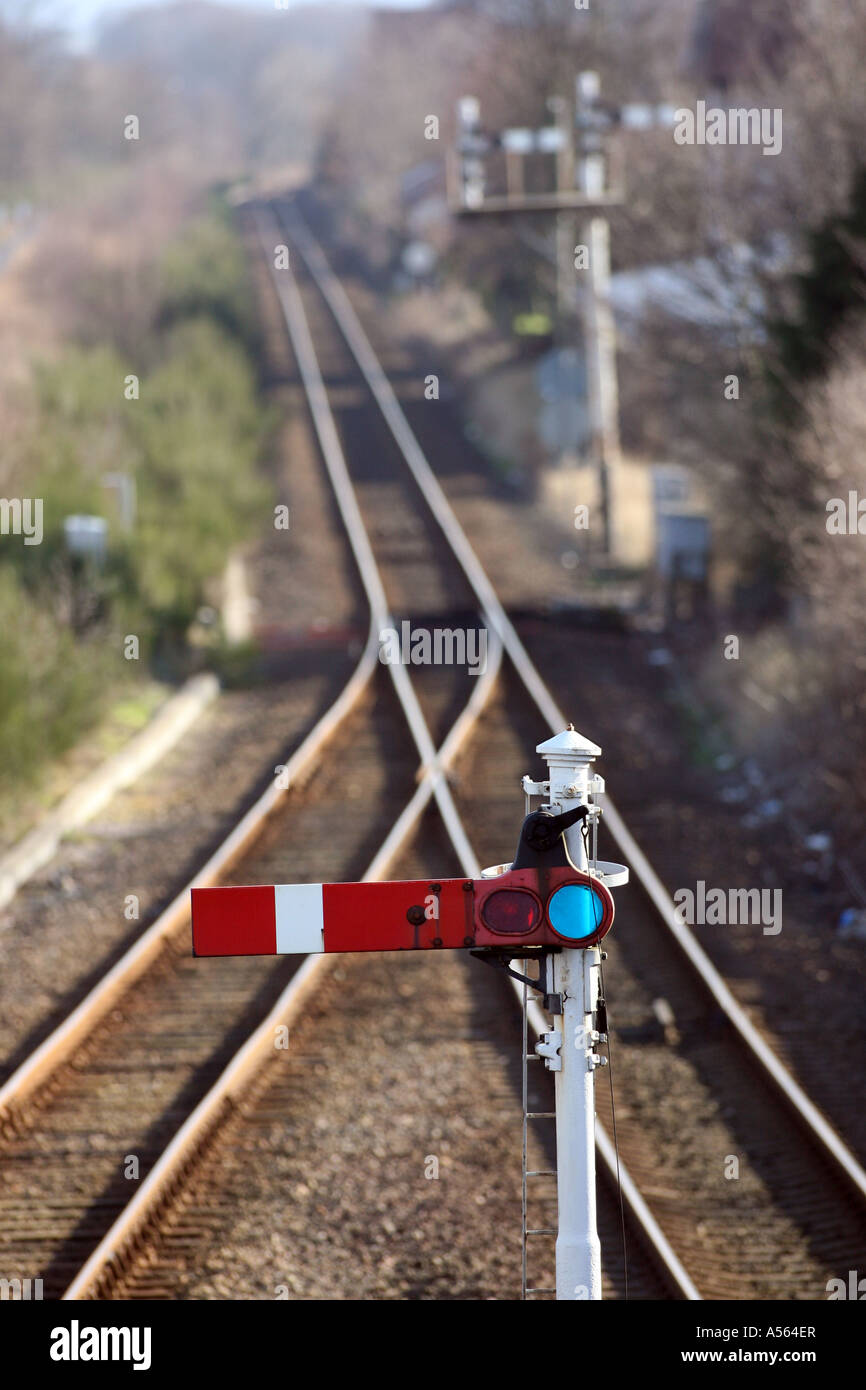 red rail signal with train tracks in background showing points Stock ...