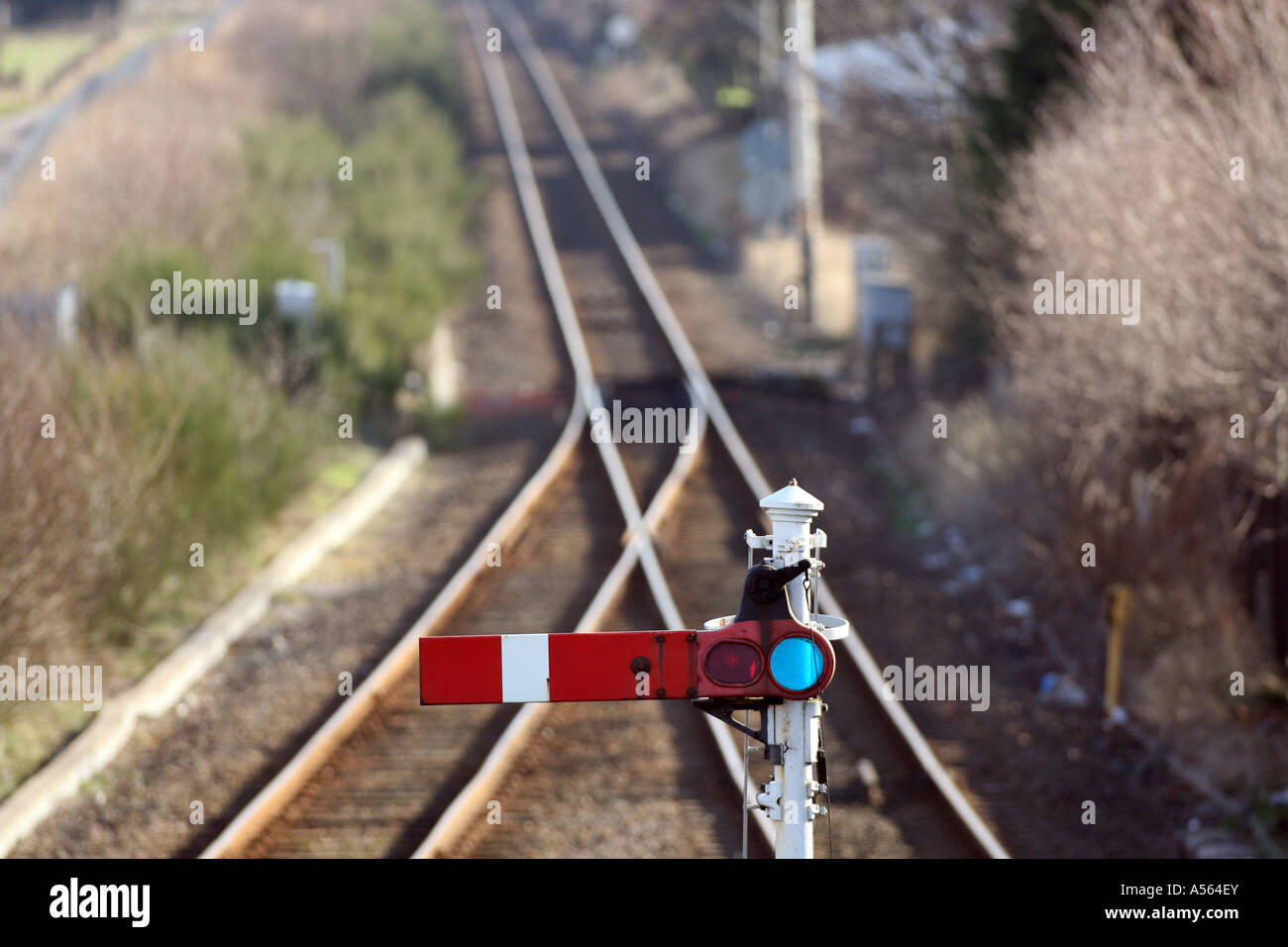 red rail signal with train tracks in background showing points Stock ...