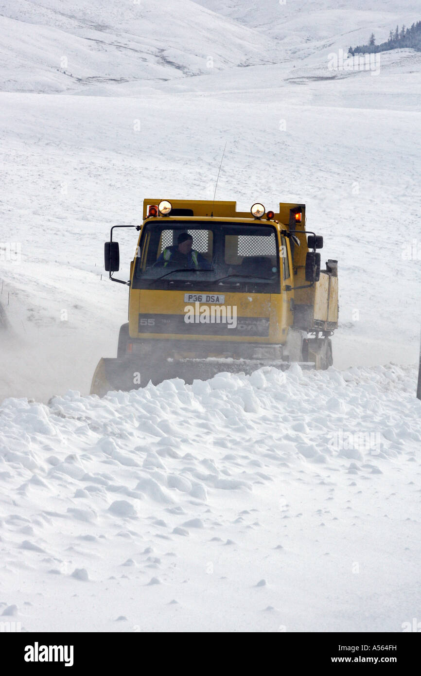 yellow snowplough clears the A939 Cockbridge to Tomintoul road of snow ...