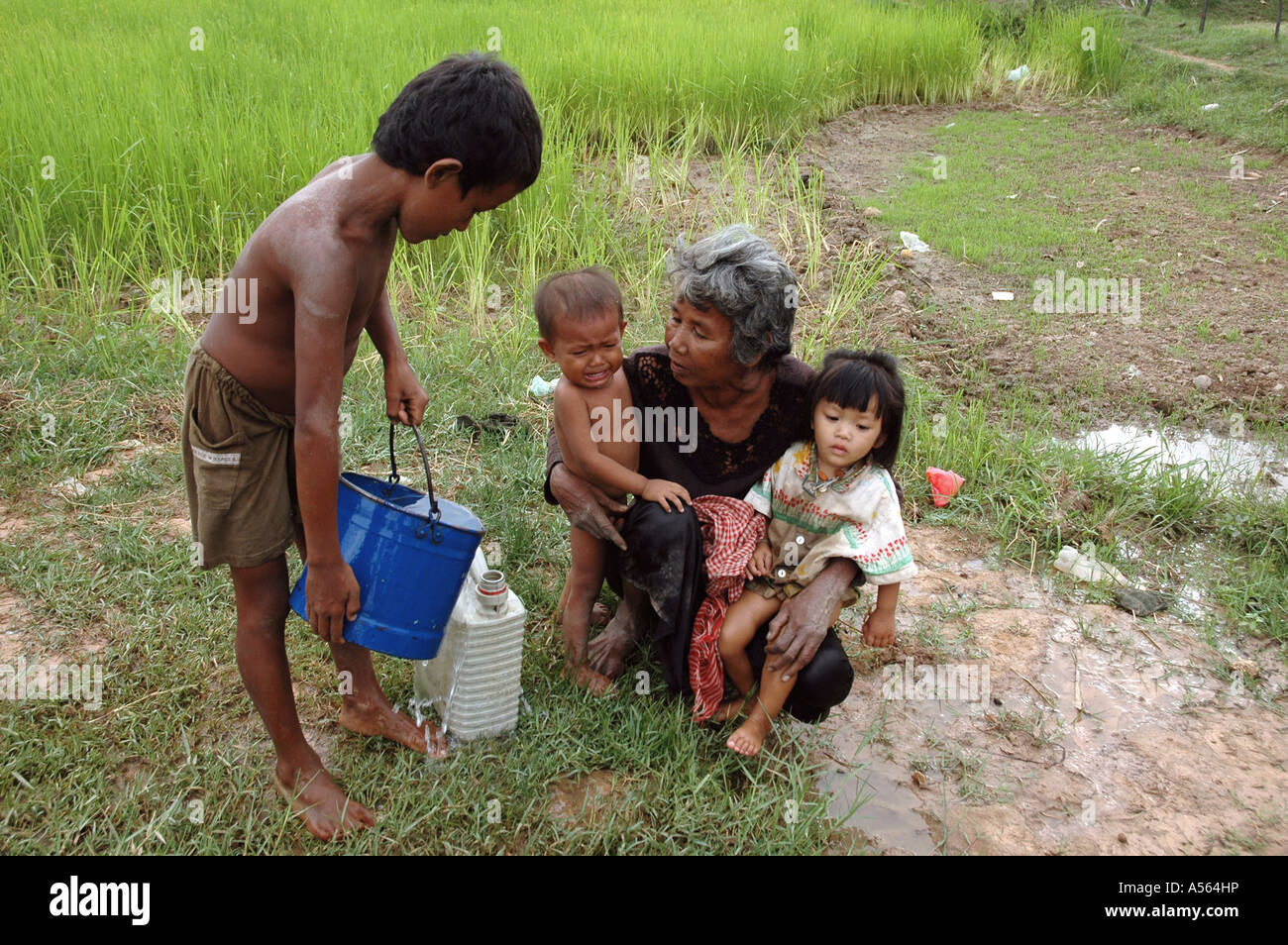 Painet ix2129 cambodia boy water carried well kampong cham country ...
