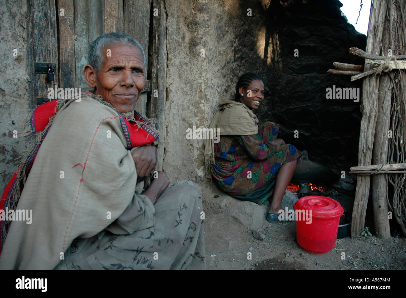 Painet iy7844 ethiopia woman cooking wood fire bilbala village lalibela ...