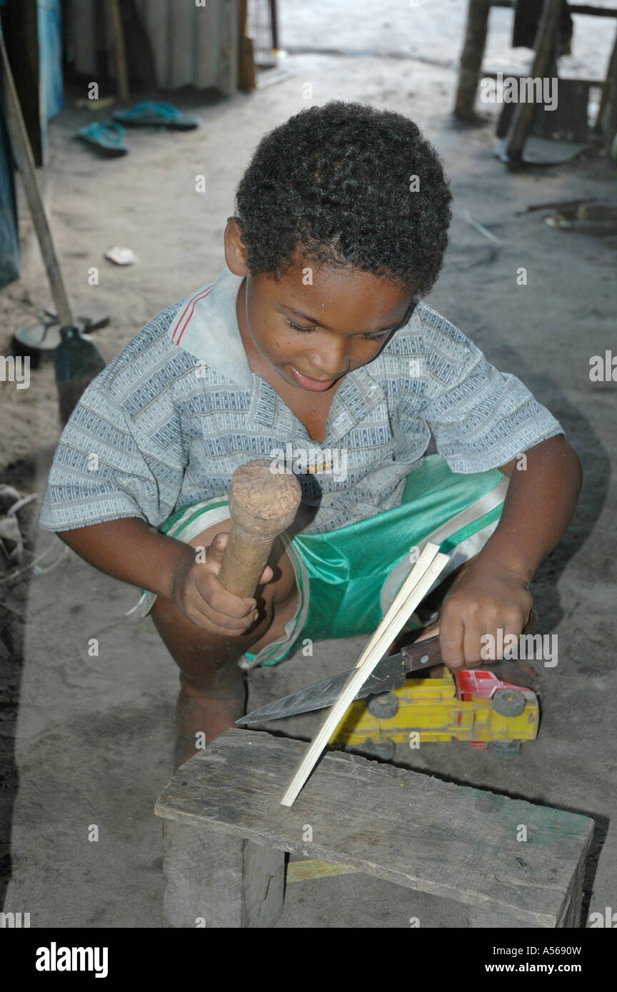 Painet iy8006 brazil boy cutting wood pinicha mombaba squatter ...
