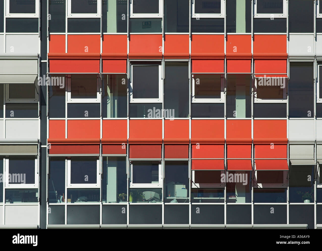 Coloured sun shades at the front of a modern office building in Hamburg ...