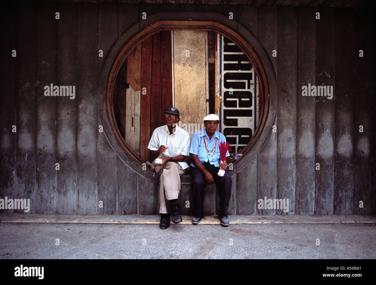 Two old Cuban men sit on a Havana street Stock Photo - Alamy