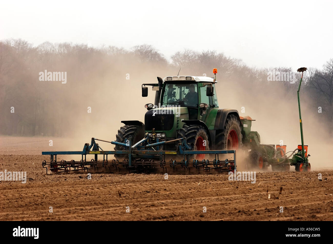 Tractor at fieldwork Stock Photo - Alamy