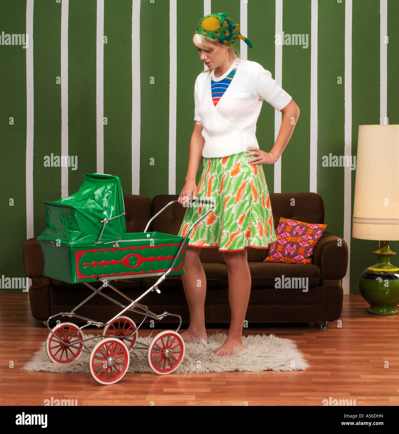 Woman with baby stroller Stock Photo - Alamy