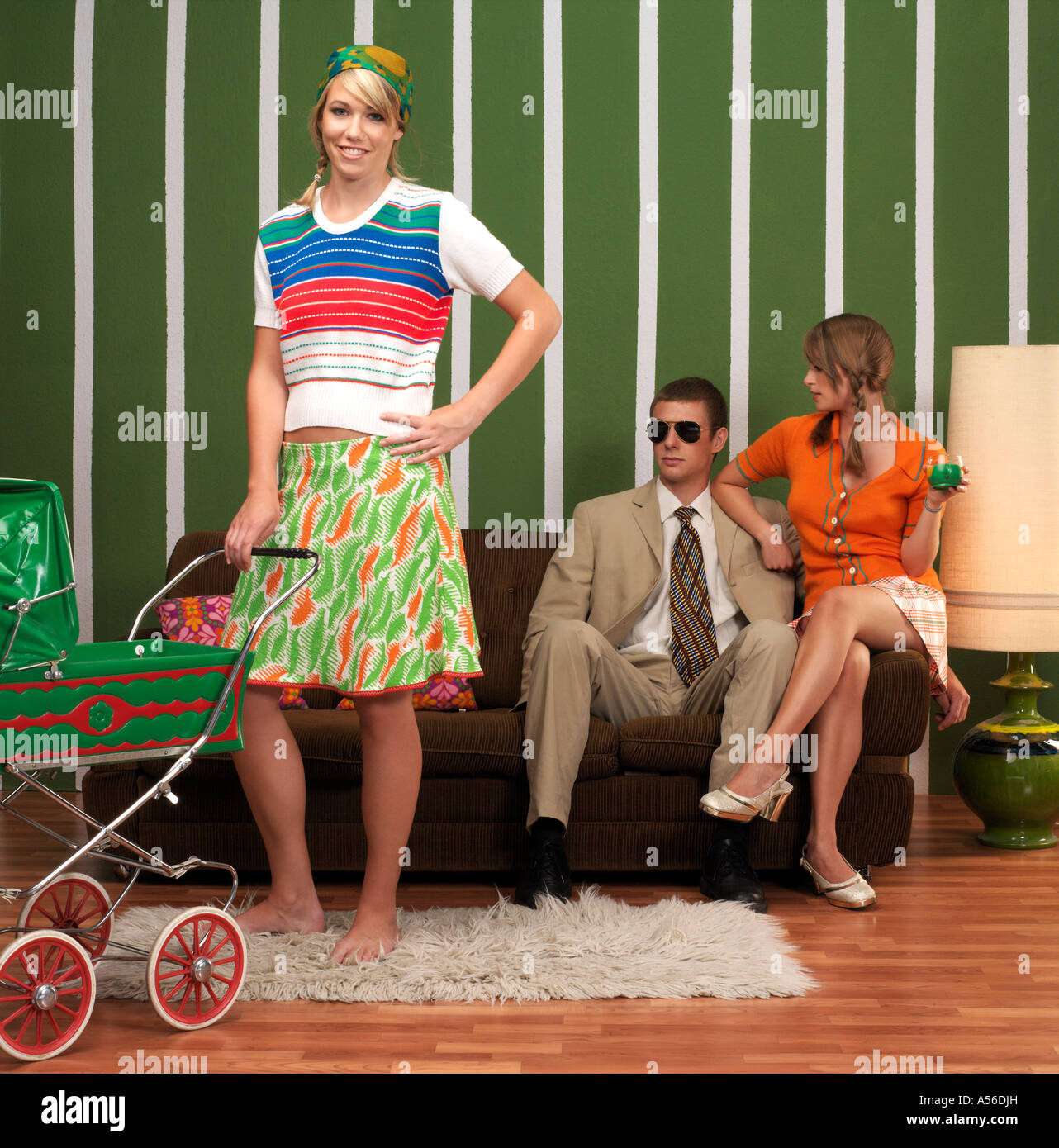 Young woman standing with baby stroller Stock Photo - Alamy