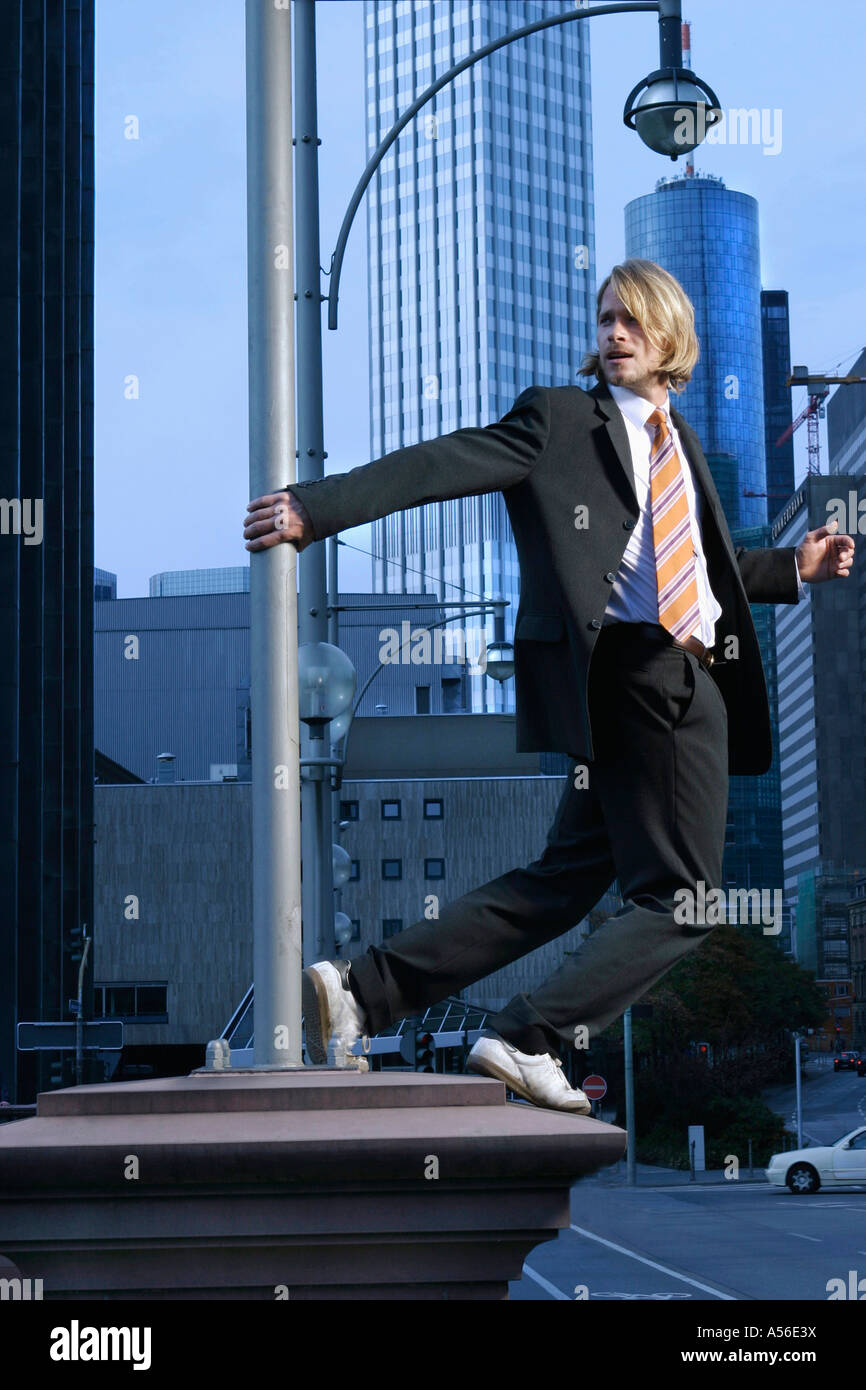 Germany, Frankfurt M., young business man balancing on railing Stock ...