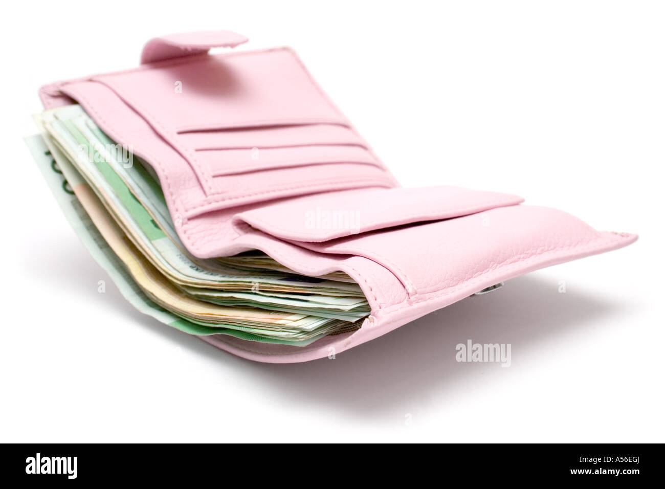 Feminine leather wallet full of banknotes. Isolated on a white ...