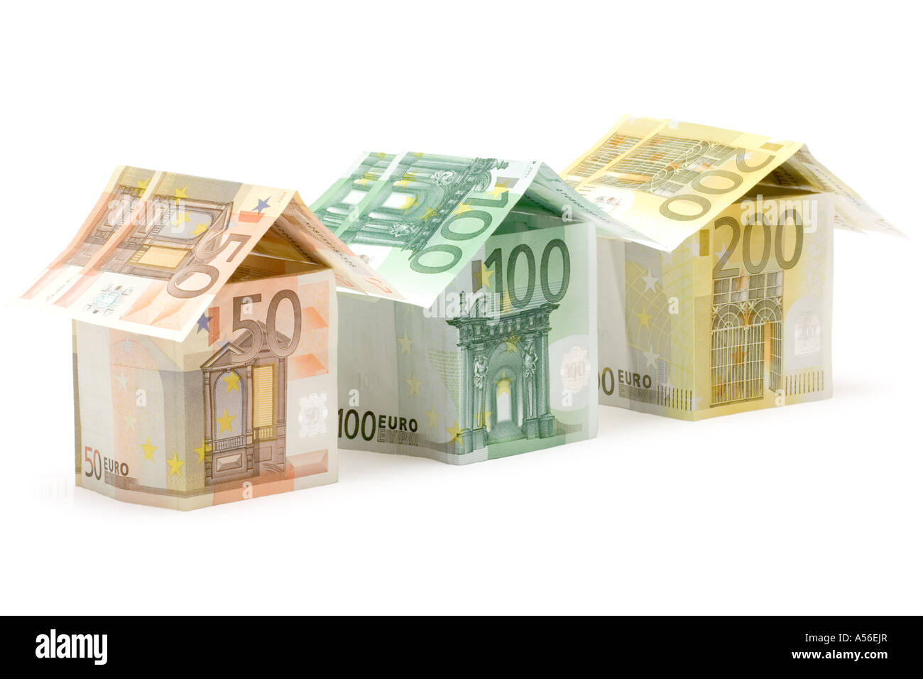Three colorful houses built of different Euro banknotes. Isolated on a ...