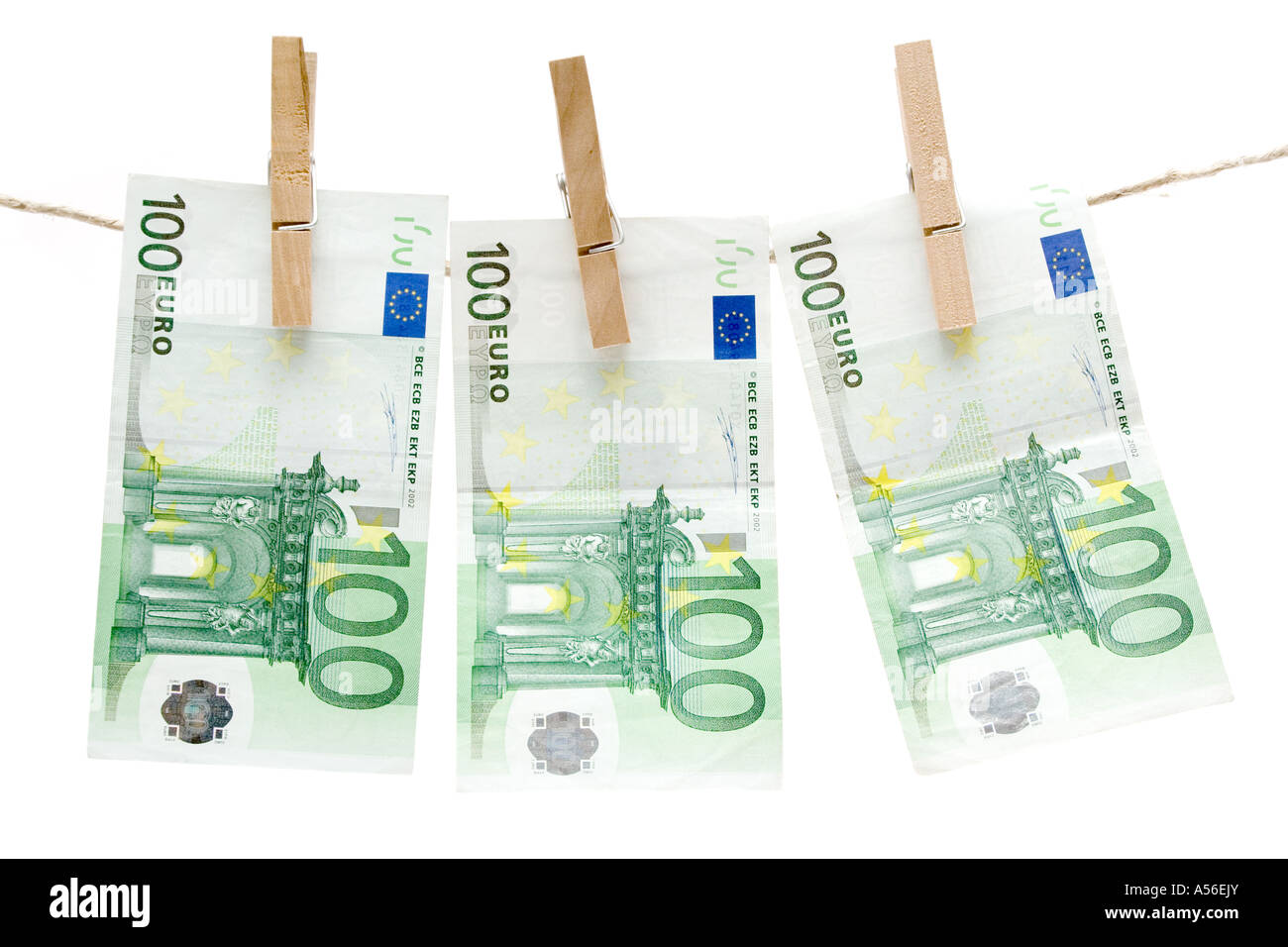 Three one hundred Euro banknotes hanging on a clothesline. Isolated on ...