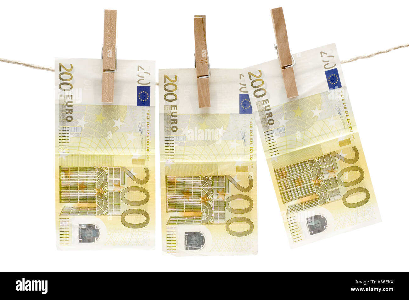Three two hundred Euro banknotes hanging on a clothesline. Isolated on ...