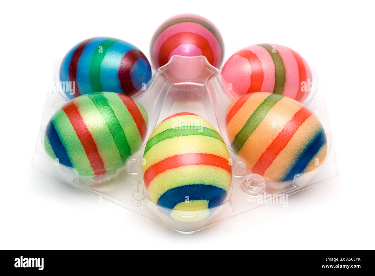 Several colored eggs arranged on a white background Stock Photo - Alamy