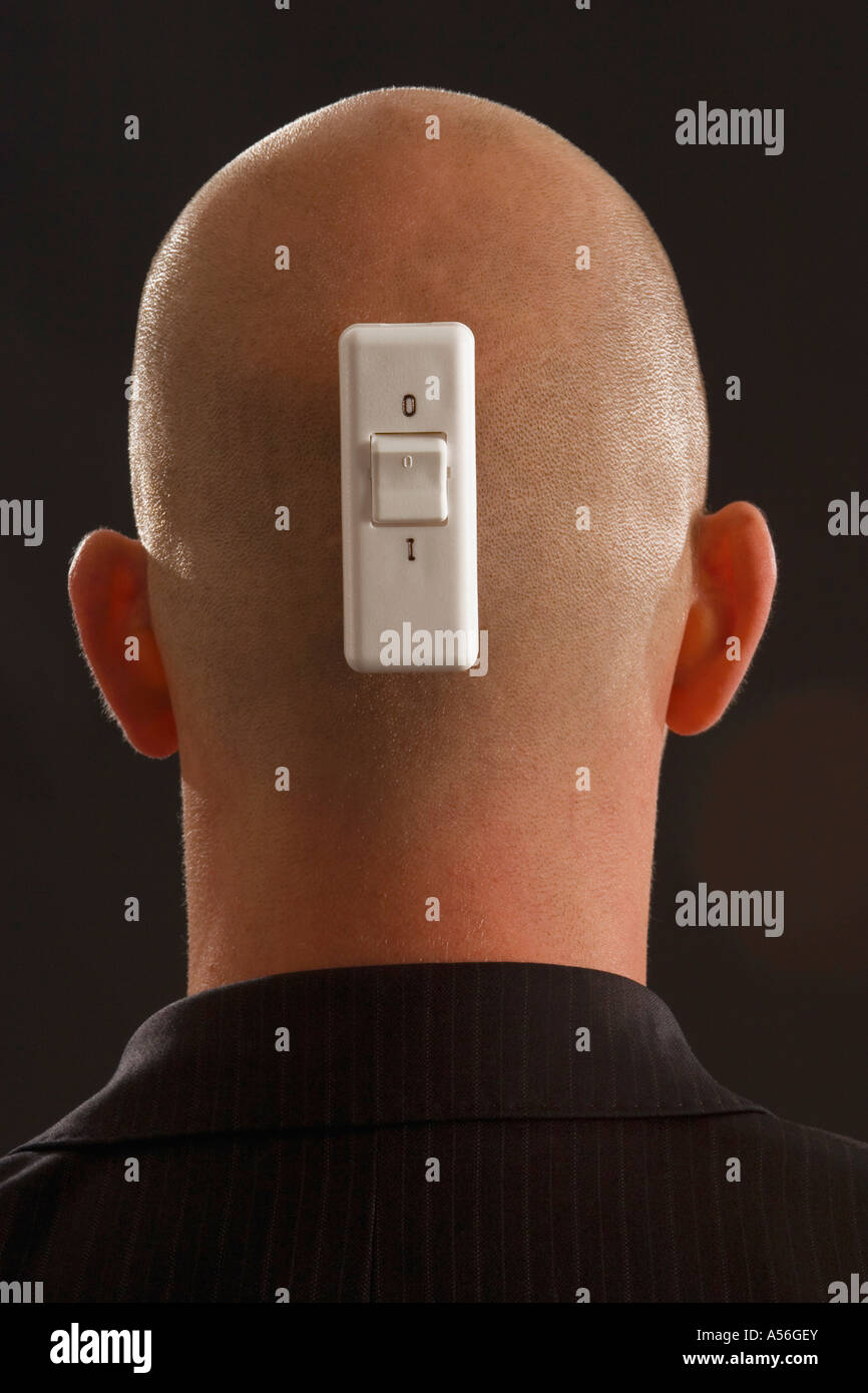 Young man with rocker switch on back of head Stock Photo - Alamy