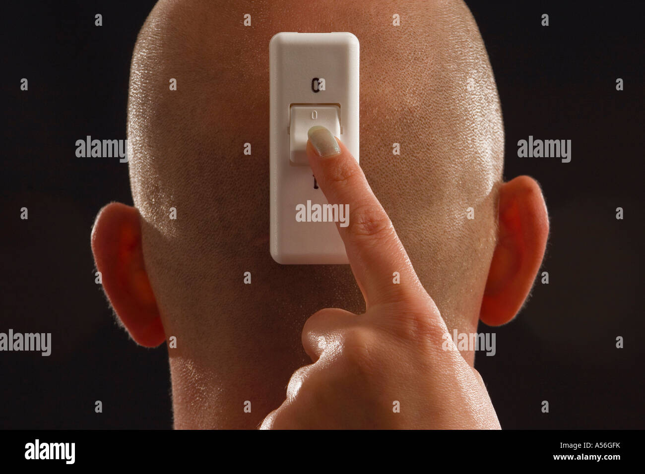 Man with rocker switch on back of head Stock Photo - Alamy