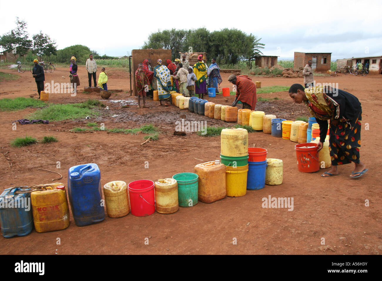 Painet iy8558 tanzania line buckets waiting filled slow tap water ...