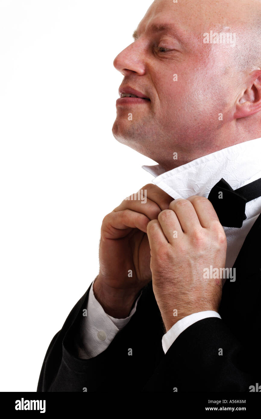 Man binding bow-tie, portrait Stock Photo - Alamy
