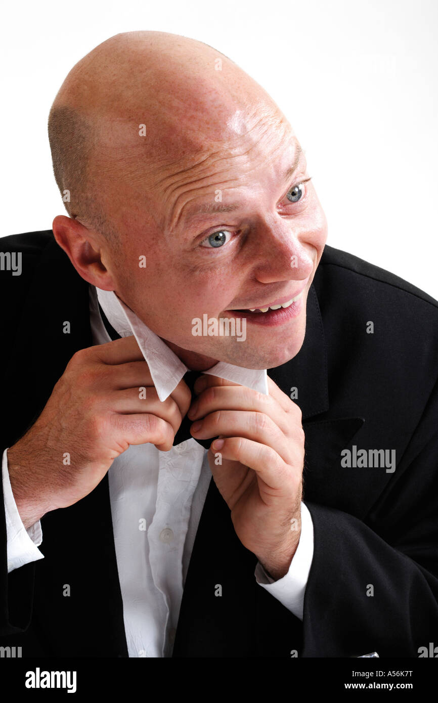 Man binding bow-tie, portrait Stock Photo - Alamy