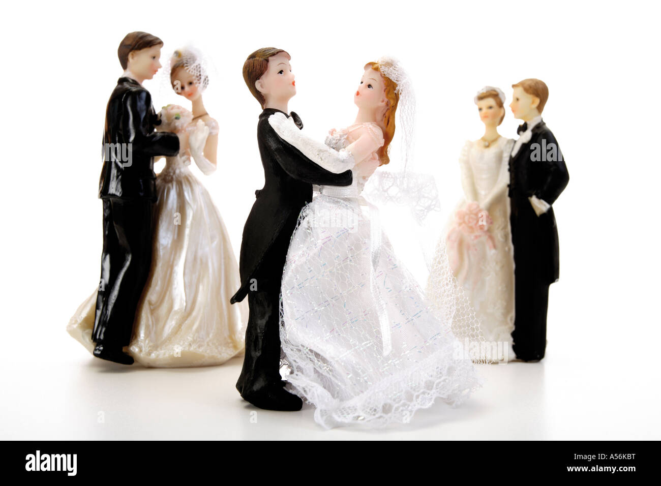Three wedding couple figurines Stock Photo - Alamy