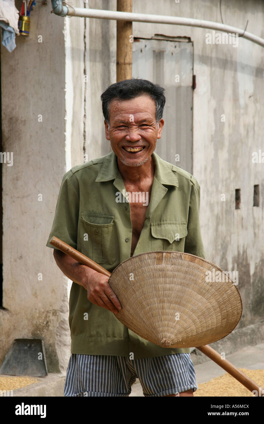 Painet iy8752 vietnam farmer raking rice dry sun front house mai linh ...