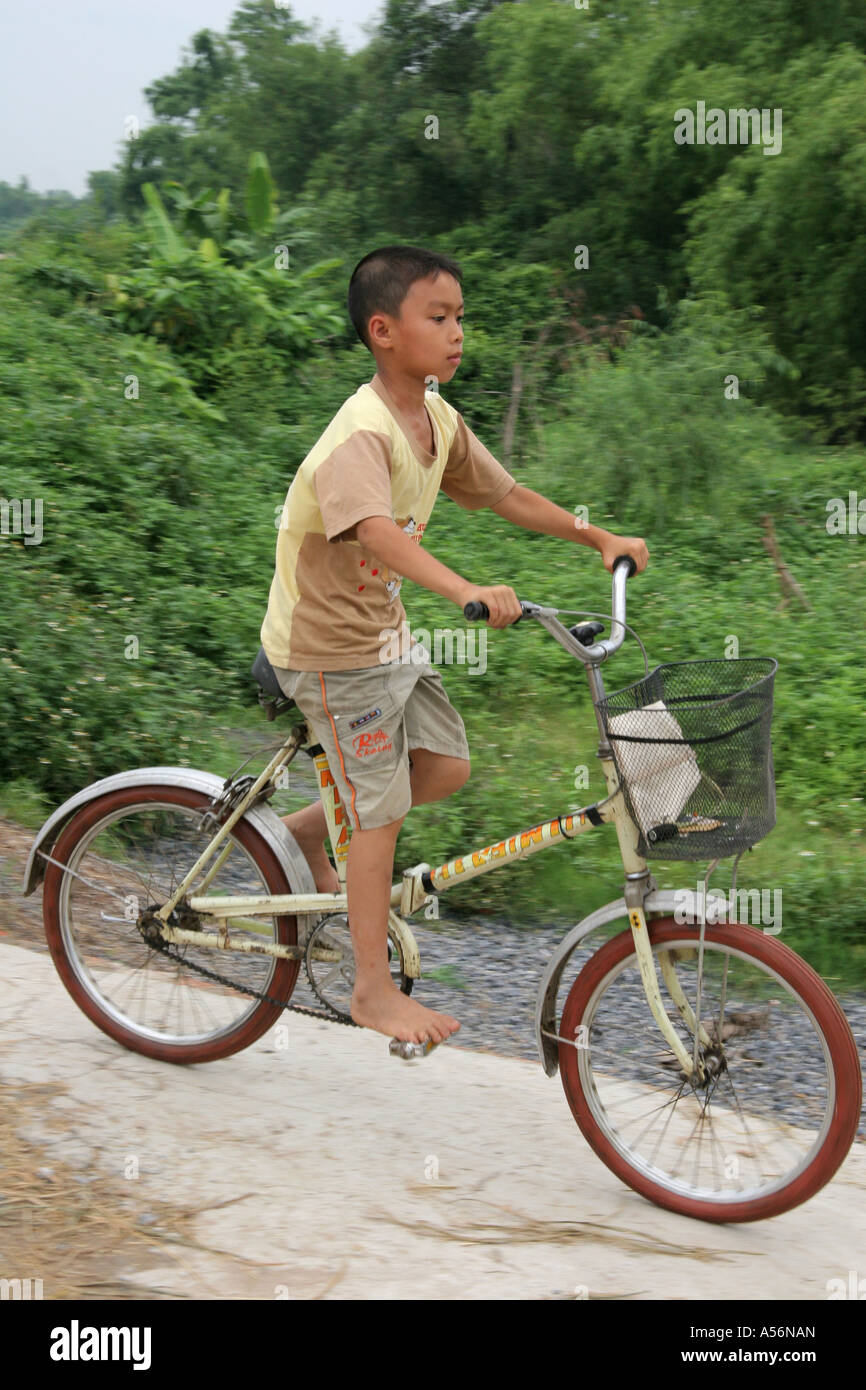 Boy transporting with his bicycle hi-res stock photography and images ...