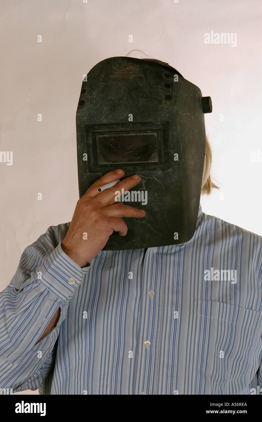 Man wearing a welders mask Stock Photo - Alamy
