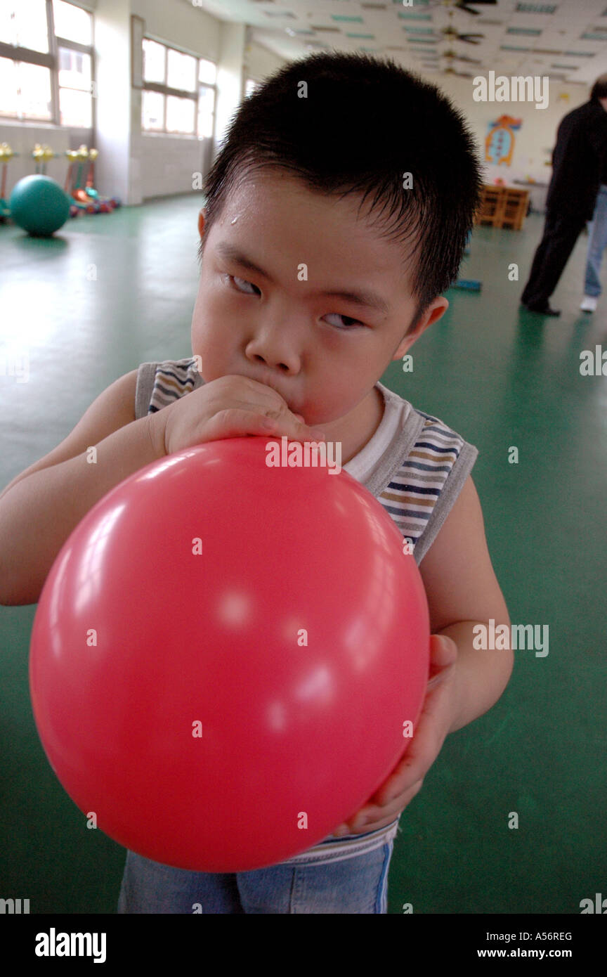 Painet ja0789 boy kid child blowing balloon taiwan catholic primary ...