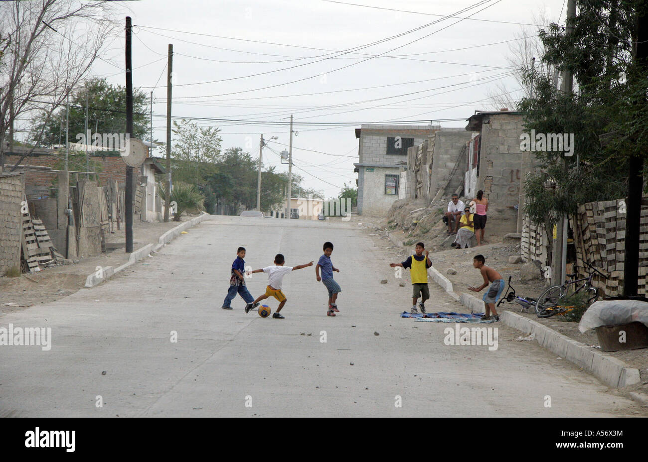 Painet ja1025 mexico hispanic boys kids children playing footbal soccer ...