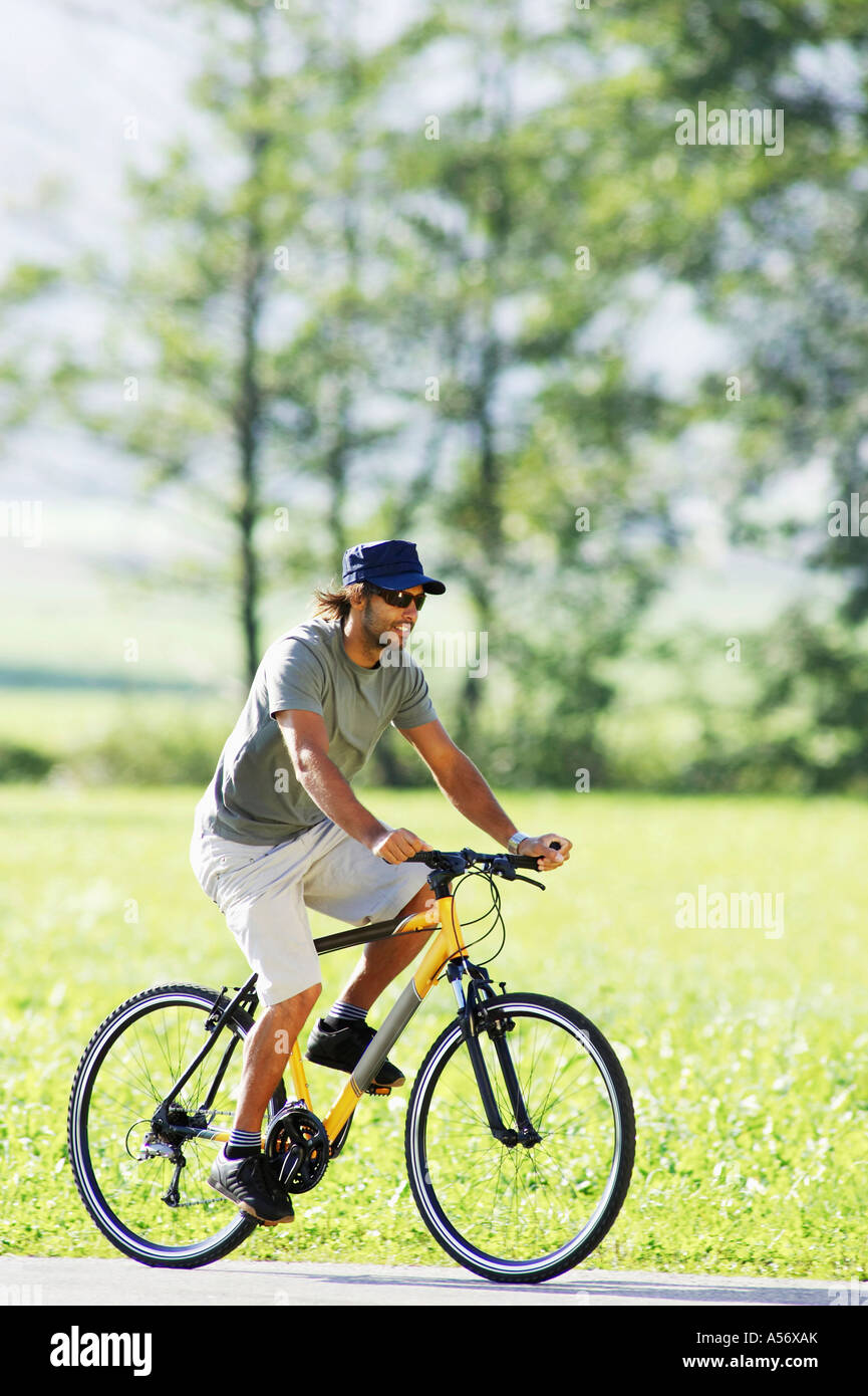 Germany, Bavaria, man riding bicycle, side view Stock Photo - Alamy