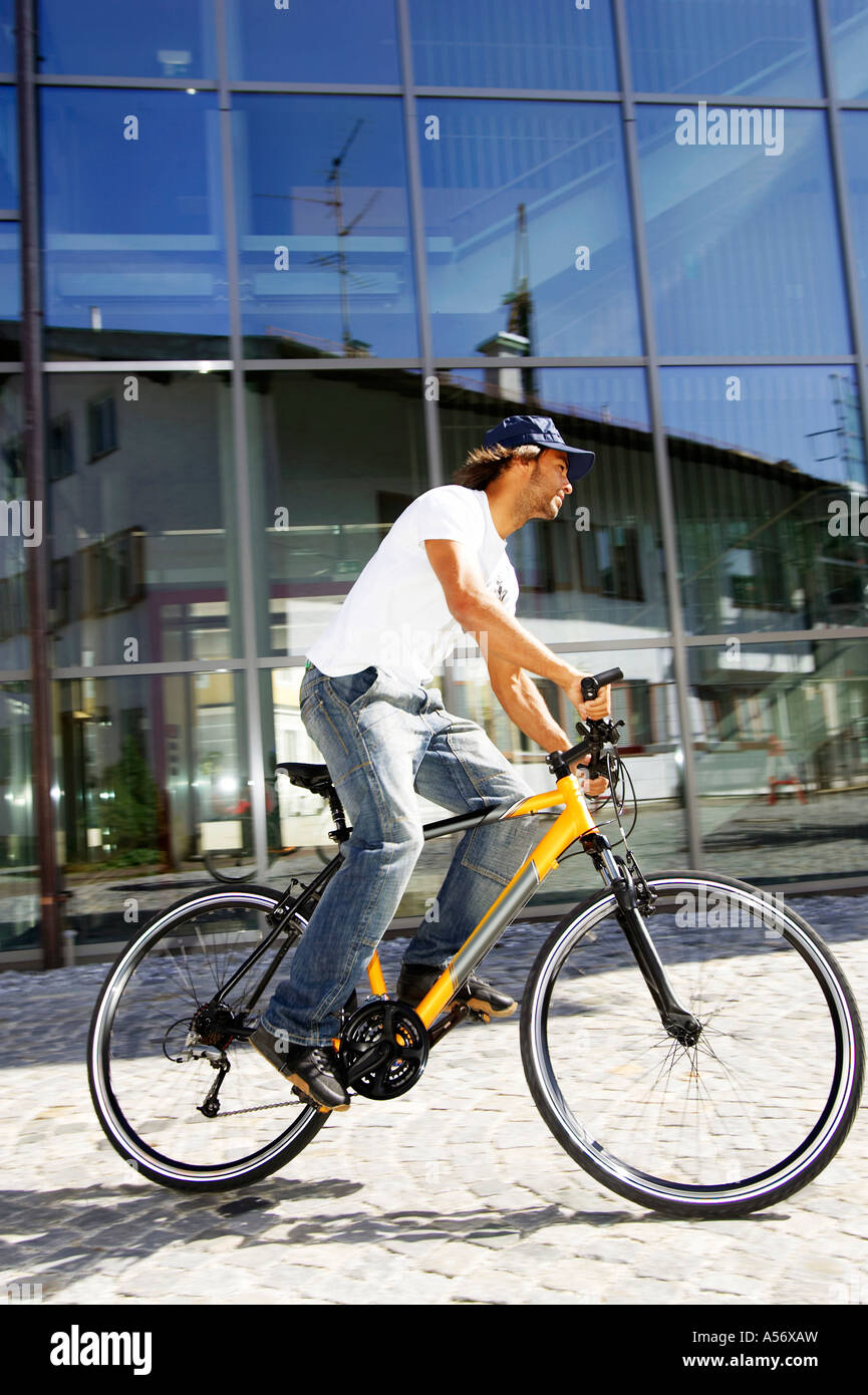 Germany, Bavaria, man riding bicycle, side view Stock Photo - Alamy