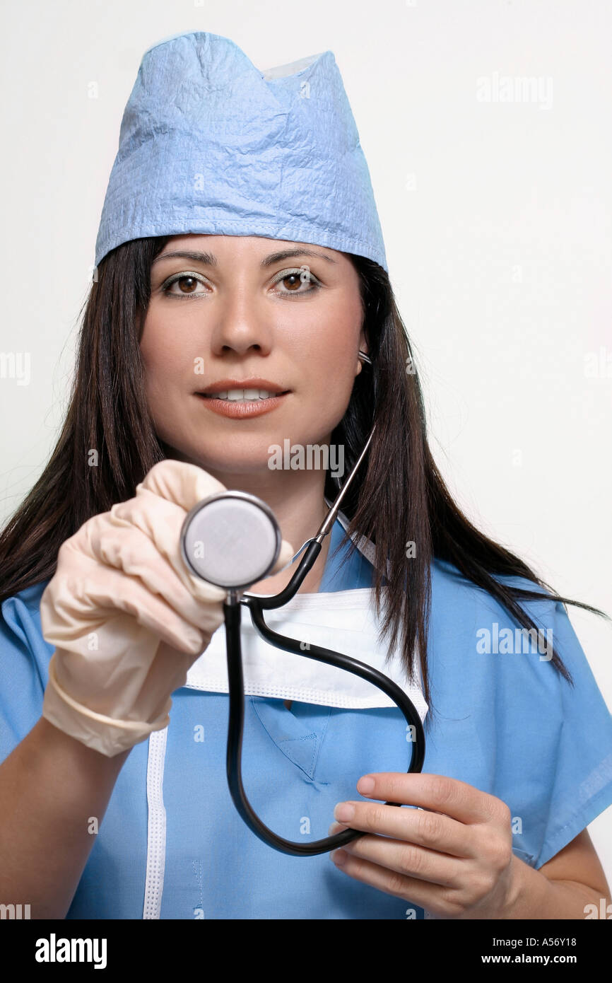 Female nurse extending a stethoscope Stock Photo - Alamy