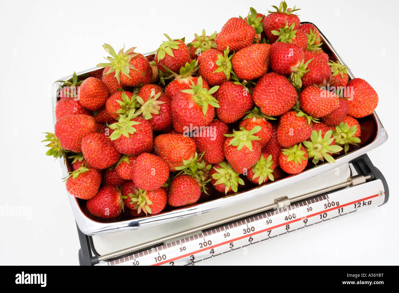 Strawberries on kitchen scale Stock Photo - Alamy