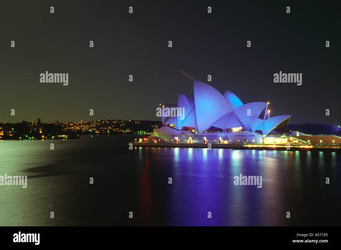 Sydney opera House by night floodlit in blue Stock Photo - Alamy